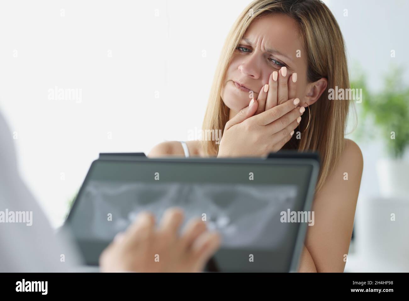 Woman in hospital with ache Stock Photo - Alamy