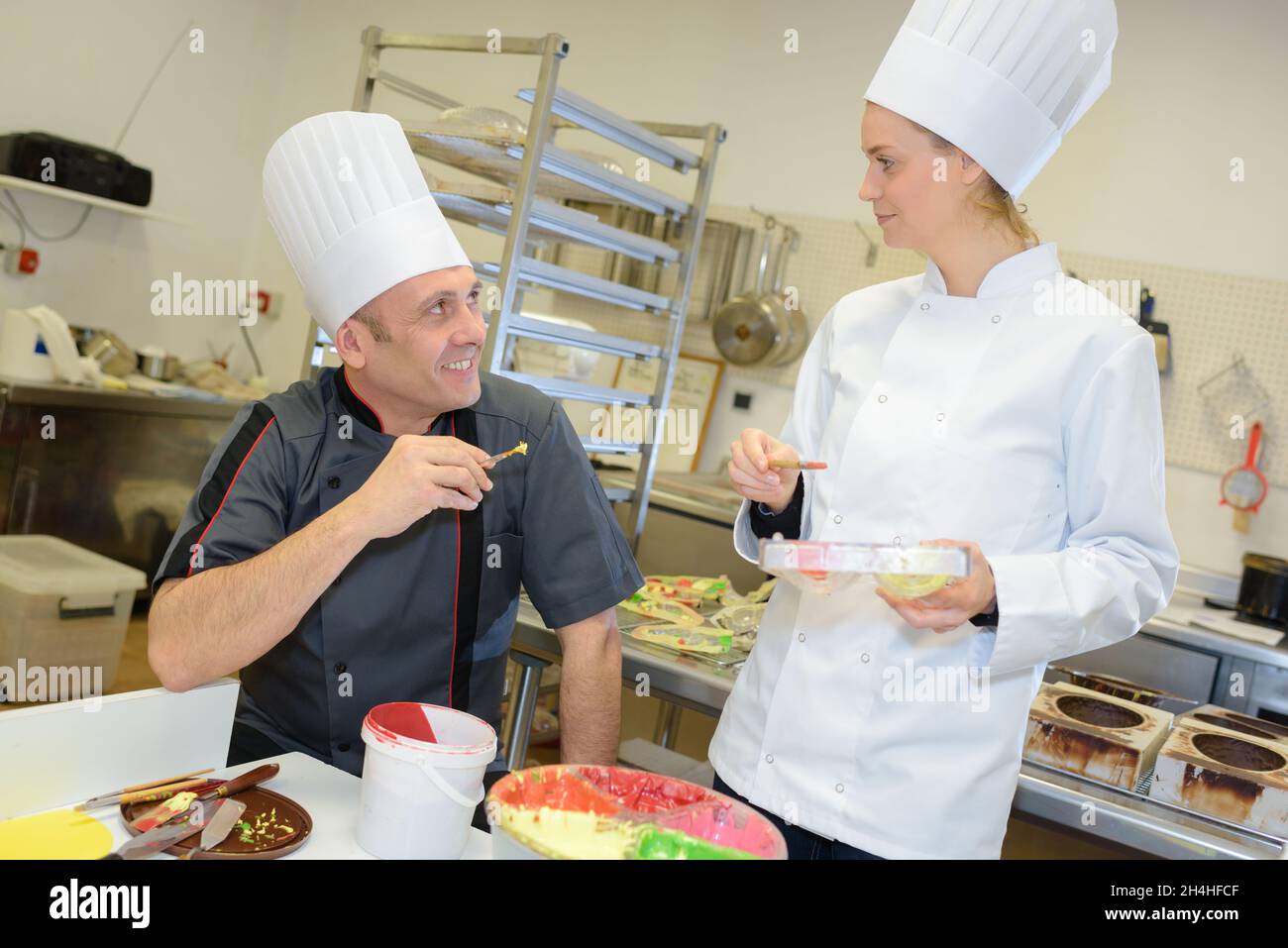 Mature female chef talking hi-res stock photography and images - Alamy