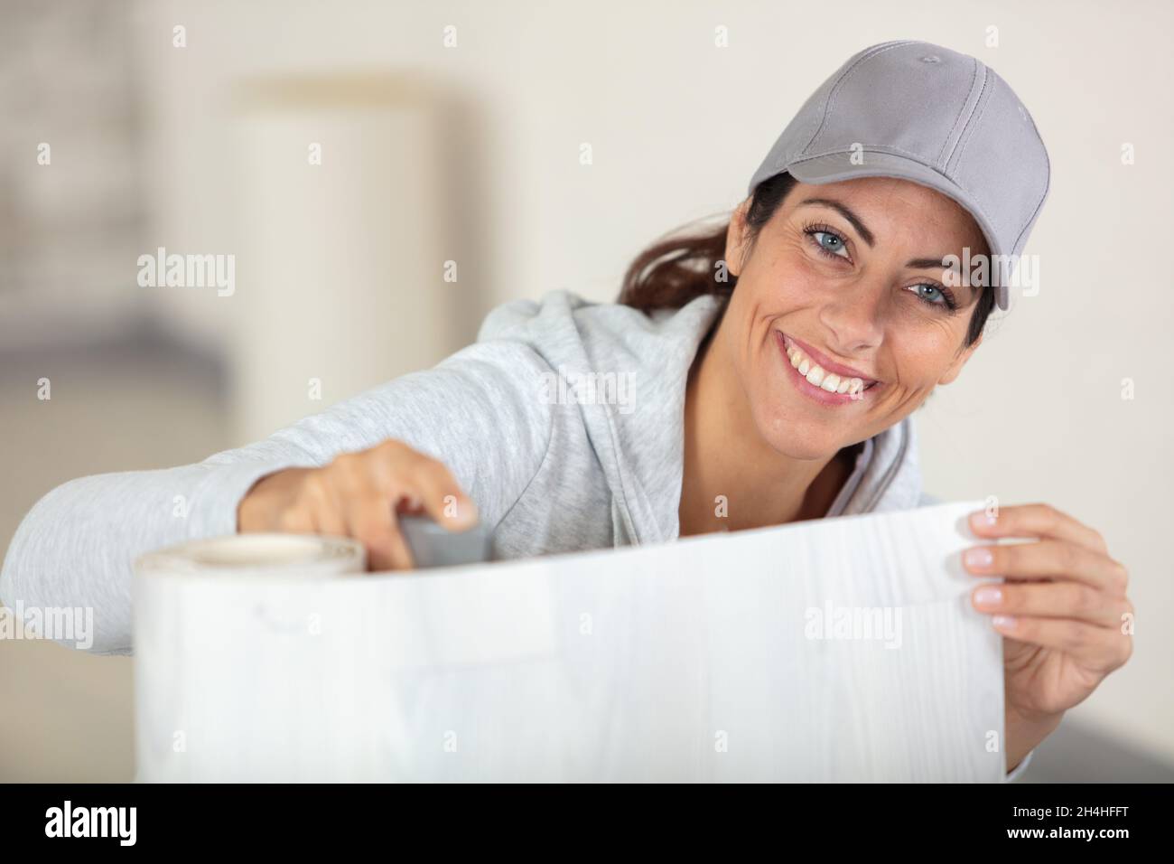 Unwrapping a parcel hi-res stock photography and images - Alamy