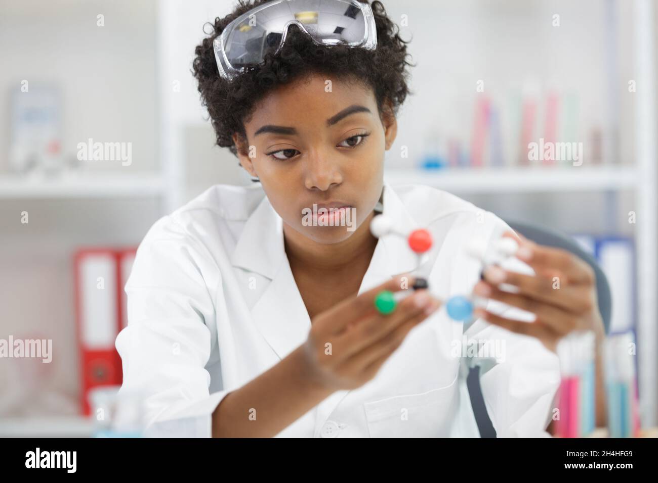 woman science technologist in laboratory presenting dna molecules Stock ...