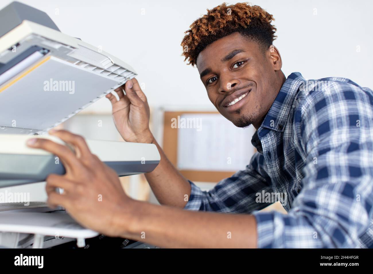 People using photocopier hi-res stock photography and images - Alamy