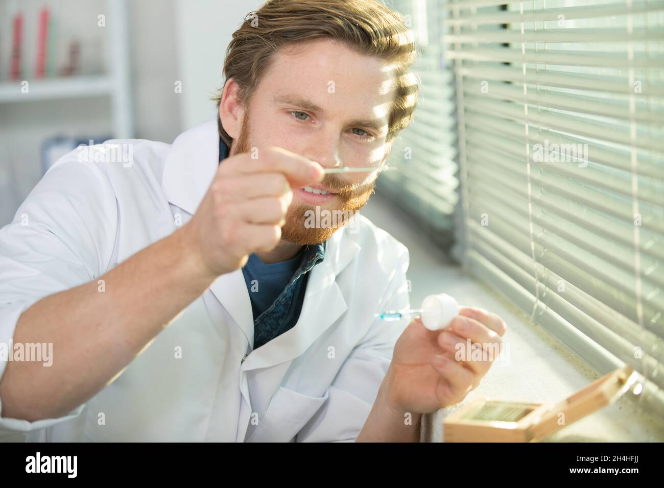 Scientist exploring in lab hi-res stock photography and images - Alamy