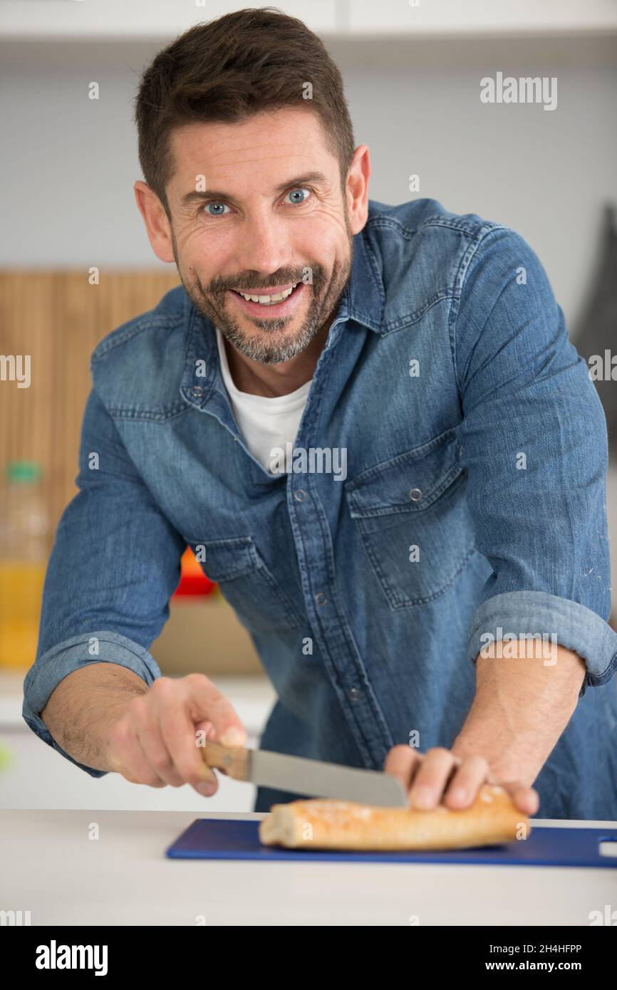 Man slices fresh tomato hi-res stock photography and images - Alamy