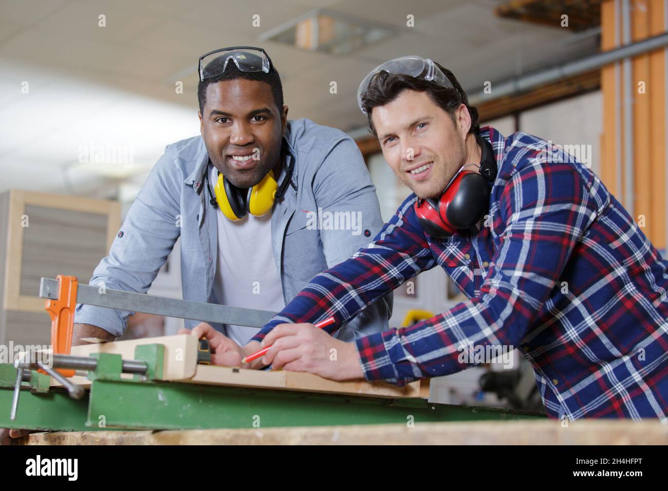 two wood carpenters at work Stock Photo - Alamy