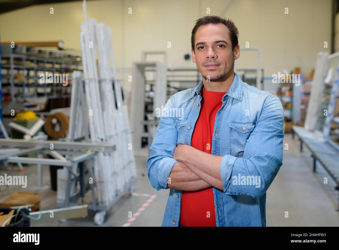 metal frame factory manager posing Stock Photo - Alamy