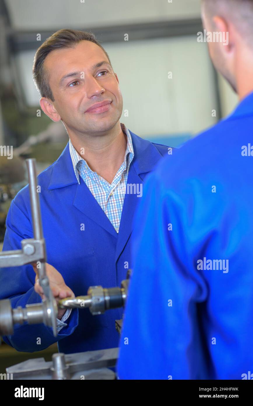 Portrait of engineer with colleague Stock Photo - Alamy