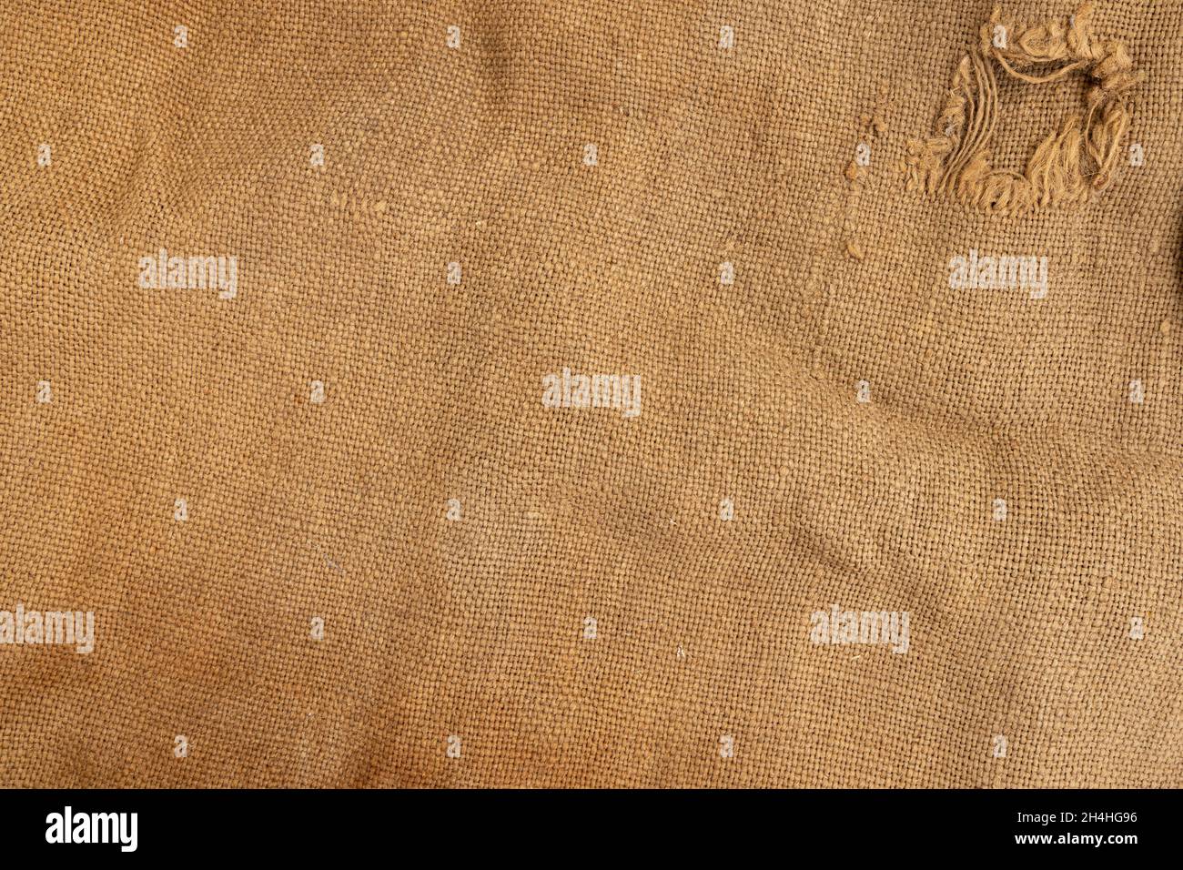 top view of sackcloth fabric for background, brown burlap backdrop ...