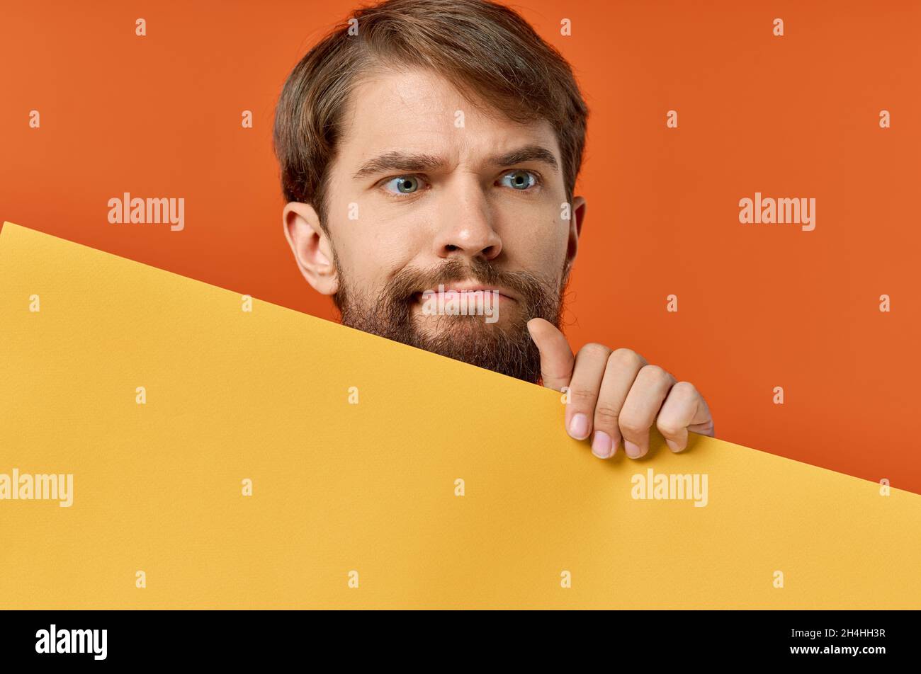 bearded man holding a yellow banner design isolated background Stock ...