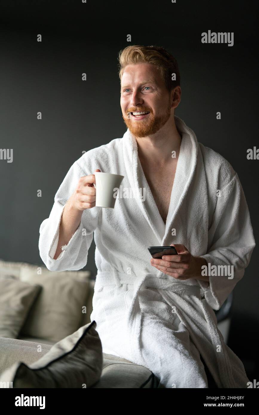 Young man having coffee home hi-res stock photography and images - Alamy