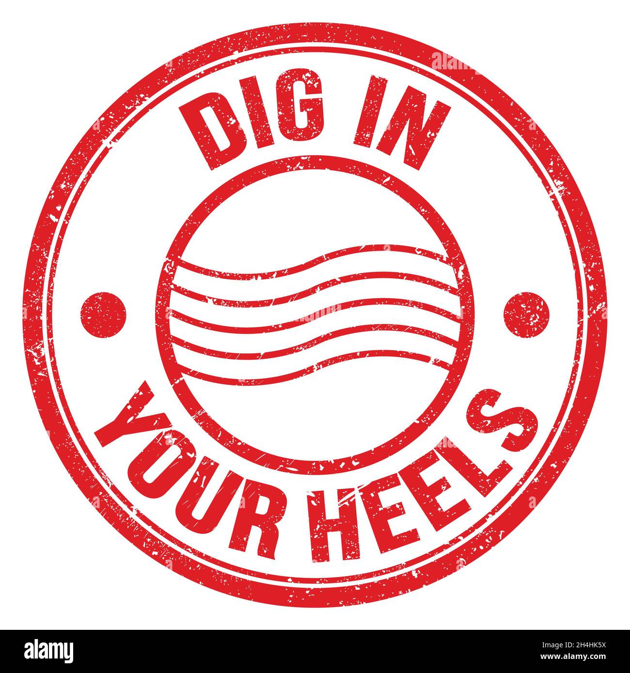 DIG IN YOUR HEELS text written on red round postal stamp sign Stock ...