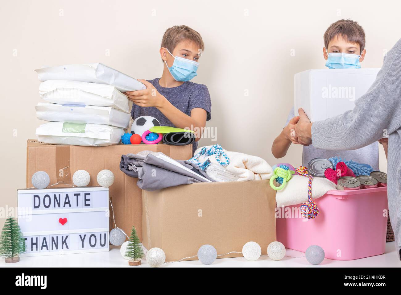 Christmas donation to animal shelter. Volunteer teenagers collecting ...