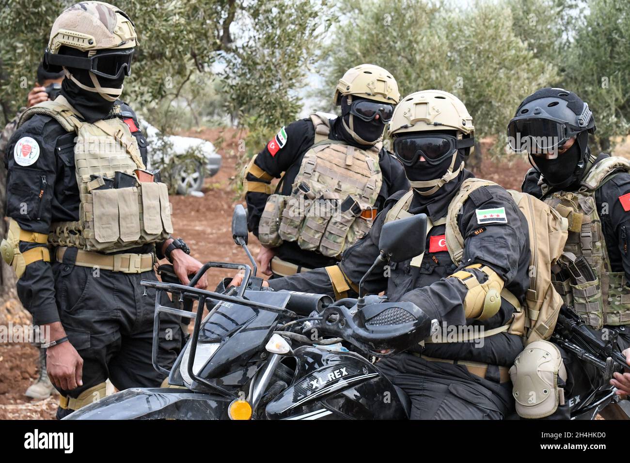 Turkish-backed Syrian rebel fighters take part in a military exercise ...