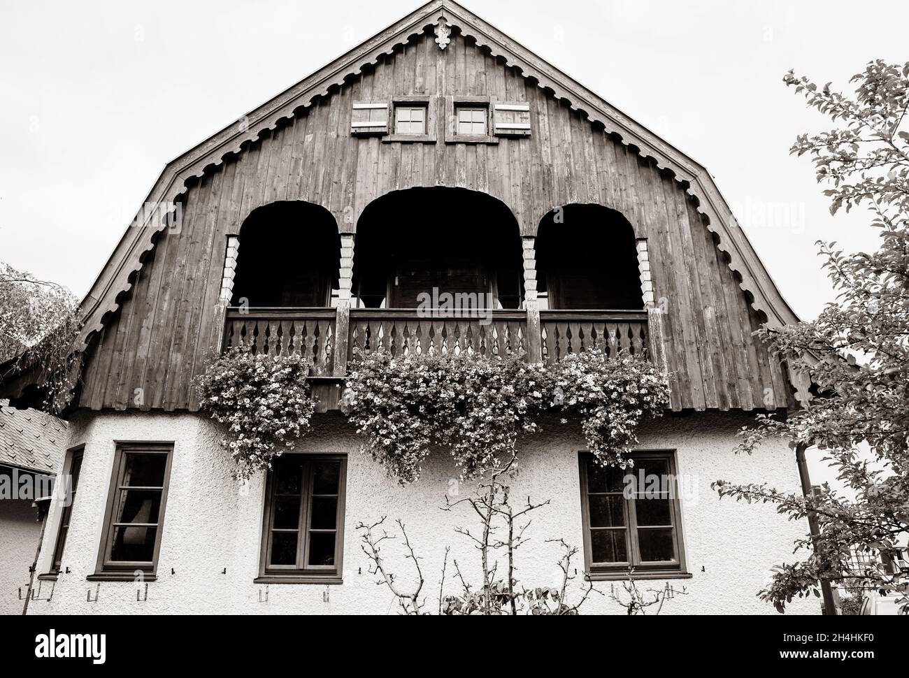 Typical Austrian architecture and gable on building with flower boxes ...