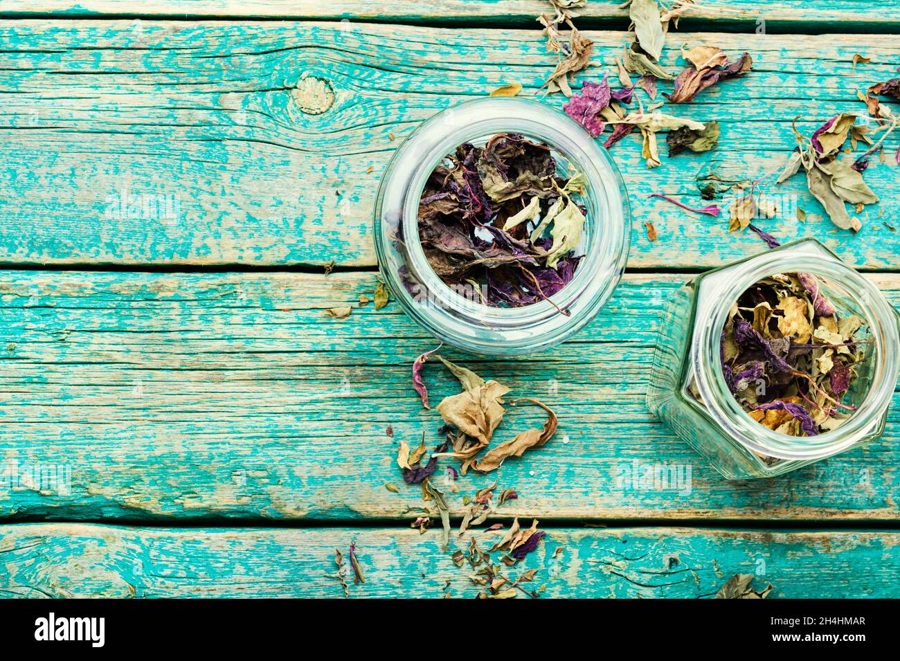 Dried natural basil spice.Natural dried herbs in glass jars.Space for ...