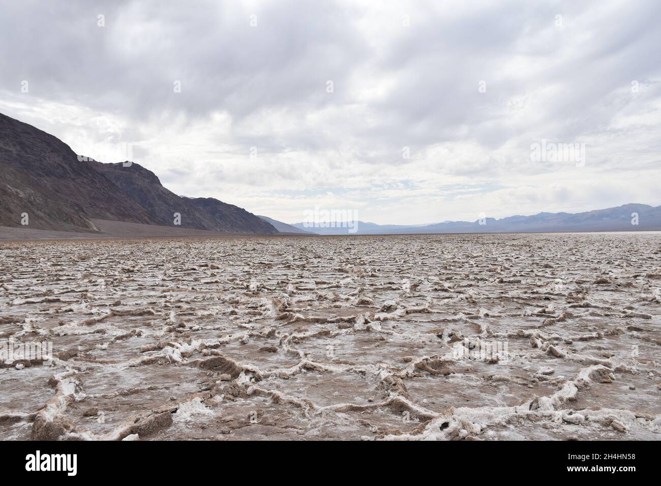 The salt-encrusted Badwater Basin, one of the lowest points on earth at ...