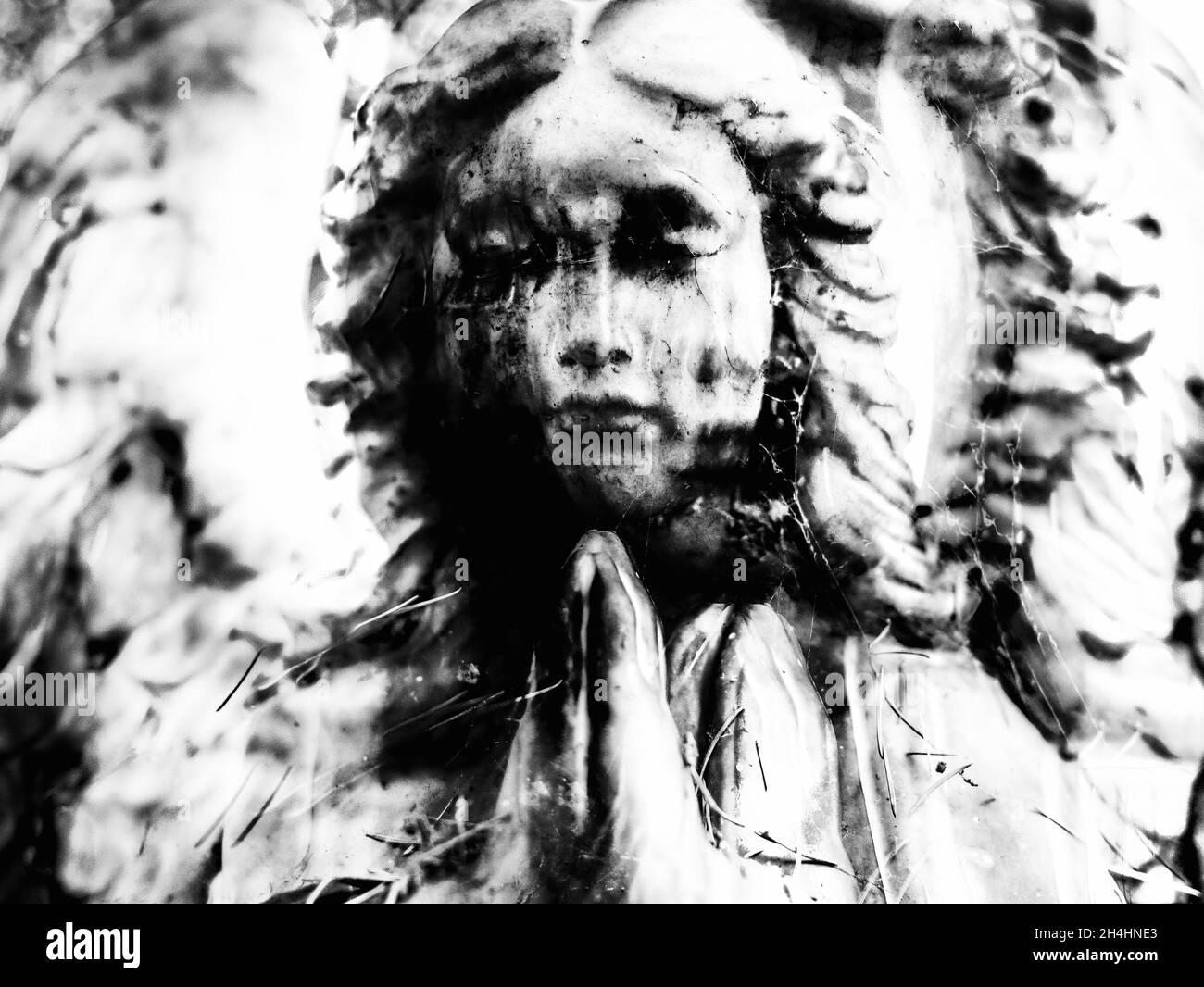 Abstract overlapping montage of an angel praying in a graveyard Stock ...