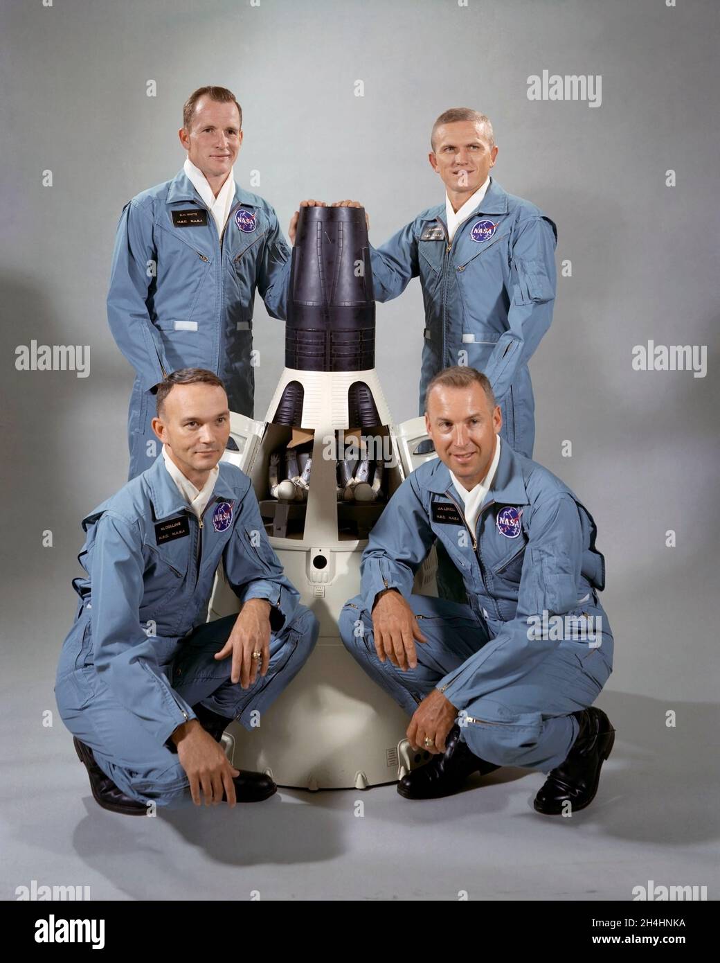 (September 1965) --- Portrait of the Gemini-7 prime and backup crew members around a model of ...