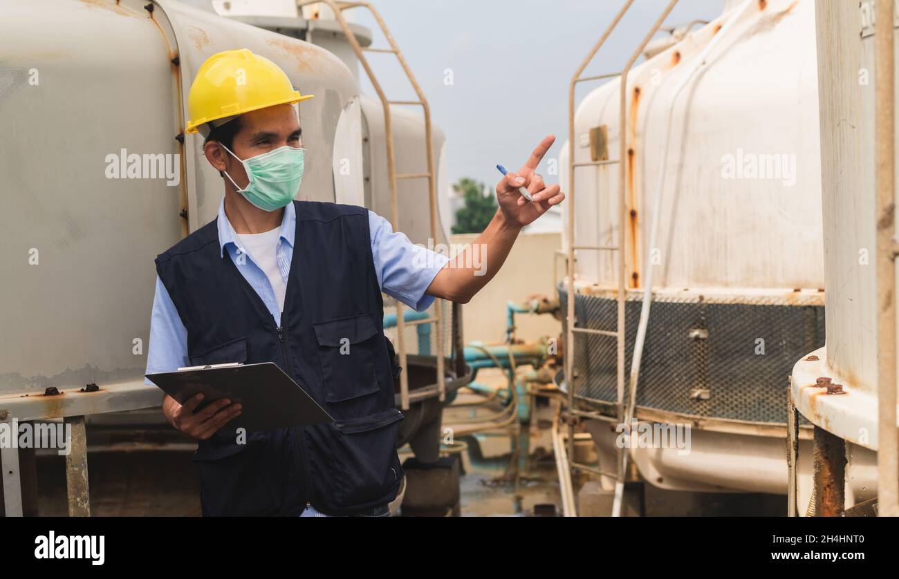 Engineer checking power plant system in factory Stock Photo - Alamy