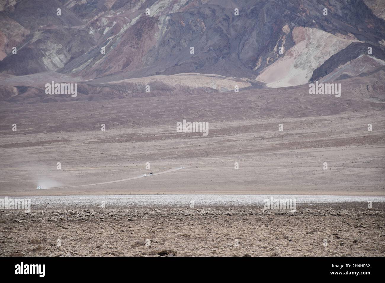 A dry, dusty unsealed road and stark haze in spring near Devil's Golf ...