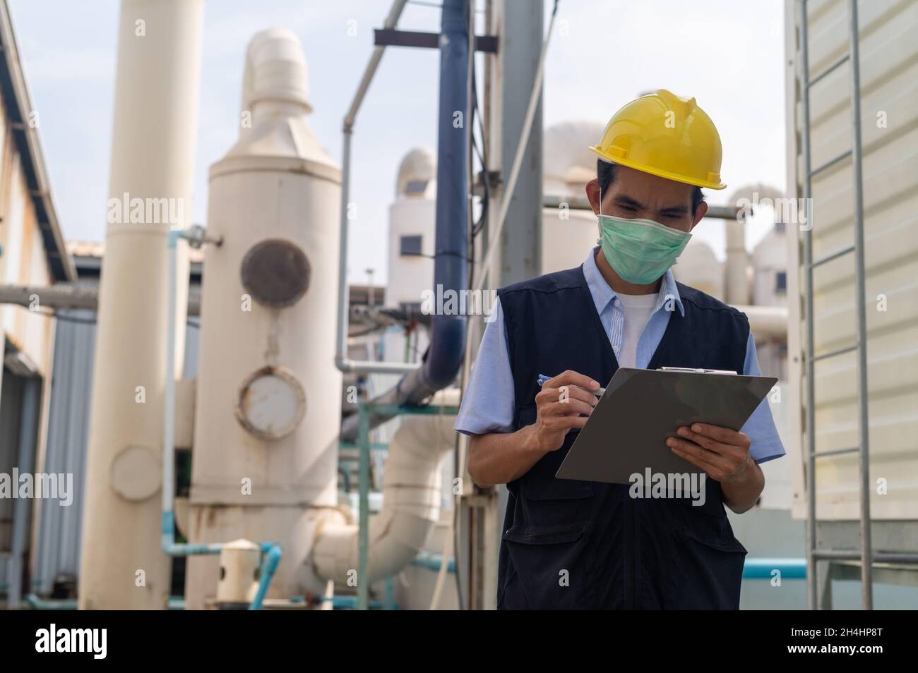 Engineer checking power plant system in factory Stock Photo - Alamy