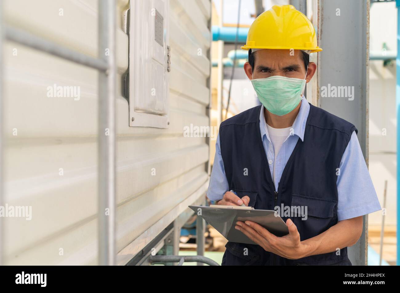 Engineers monitor the operation of industrial machinery and control ...