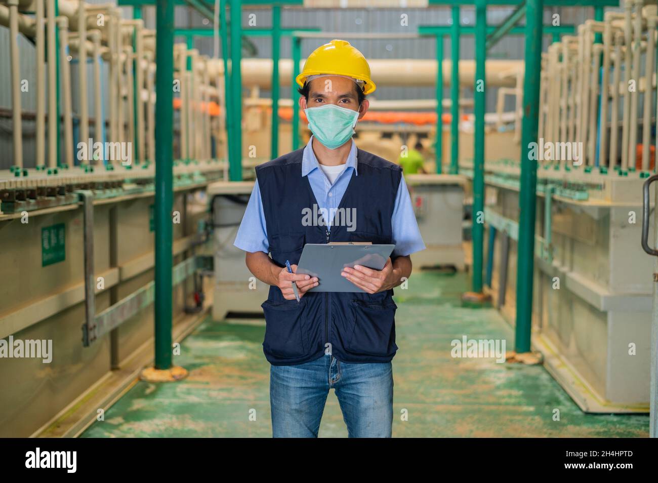 Engineers monitor the operation of industrial machinery and control ...