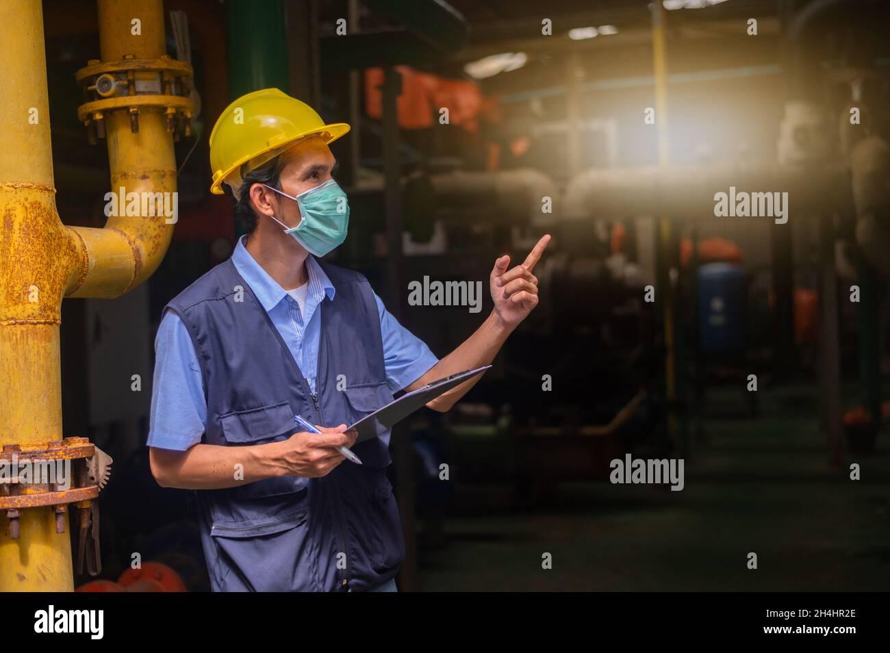 Engineers monitor the operation of industrial machinery and control ...