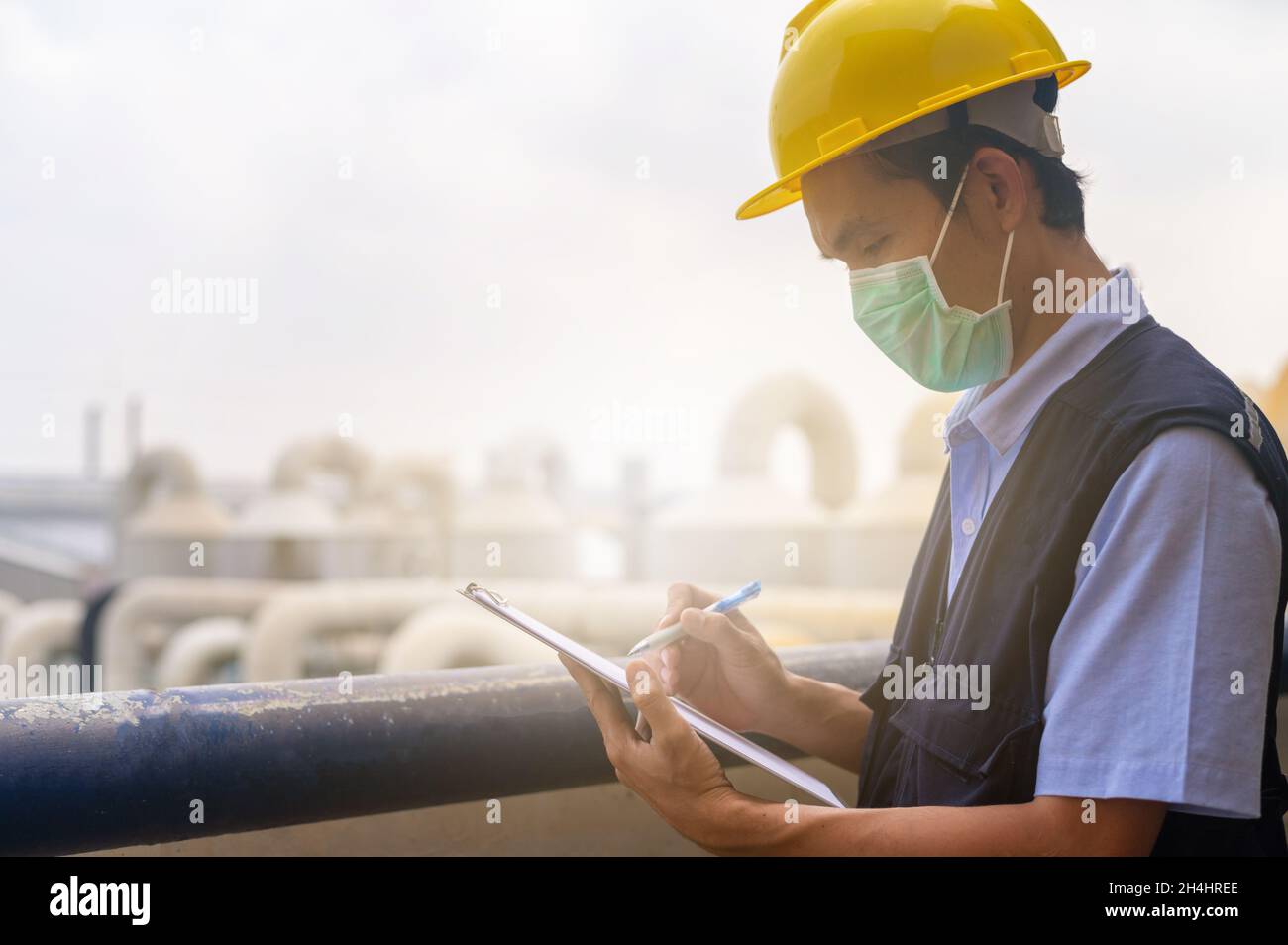 Engineers write industrial factory inspection reports Stock Photo - Alamy