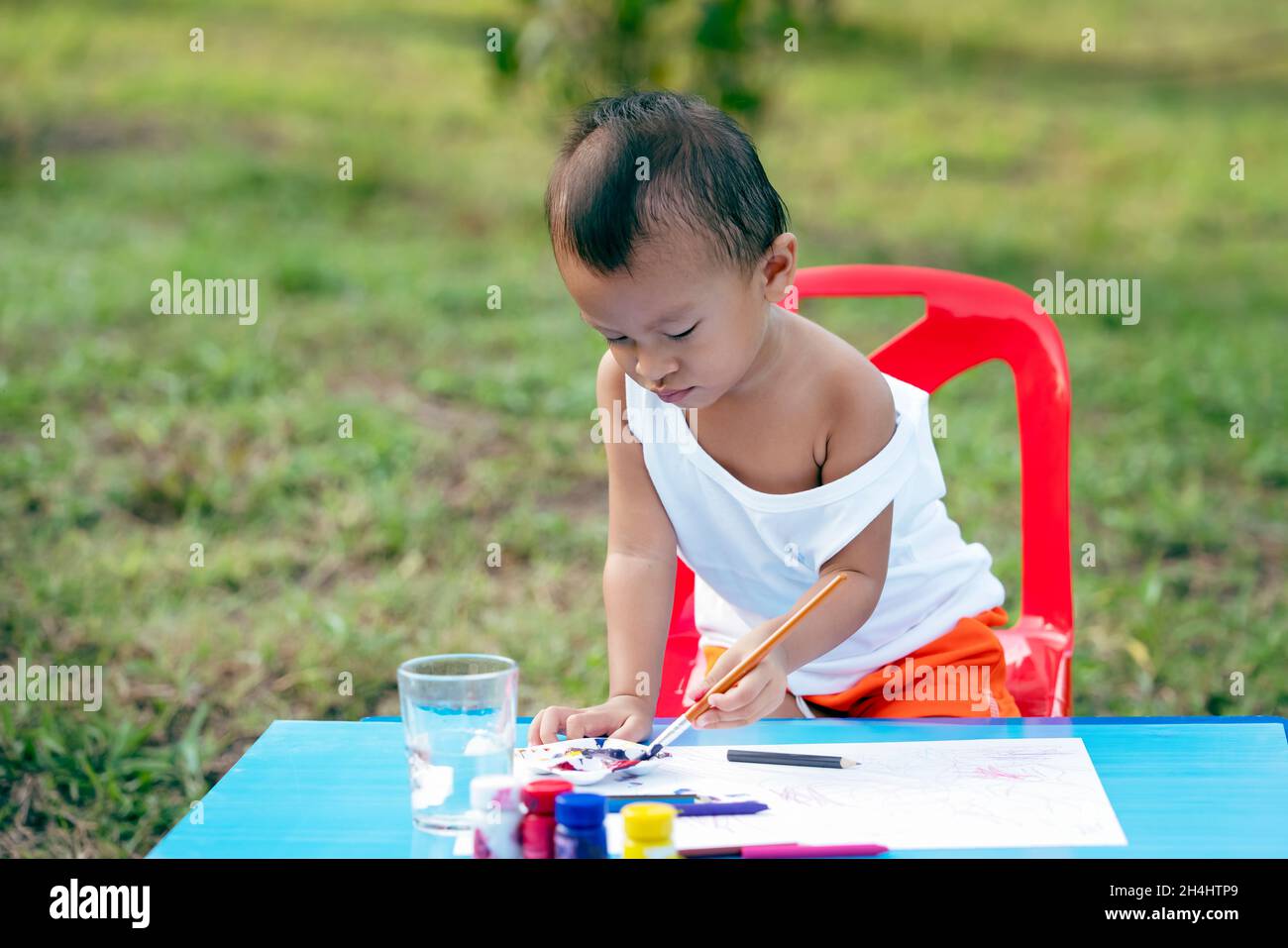 Kid Painting. Happy little cute child girl with dirty hands and fingers ...