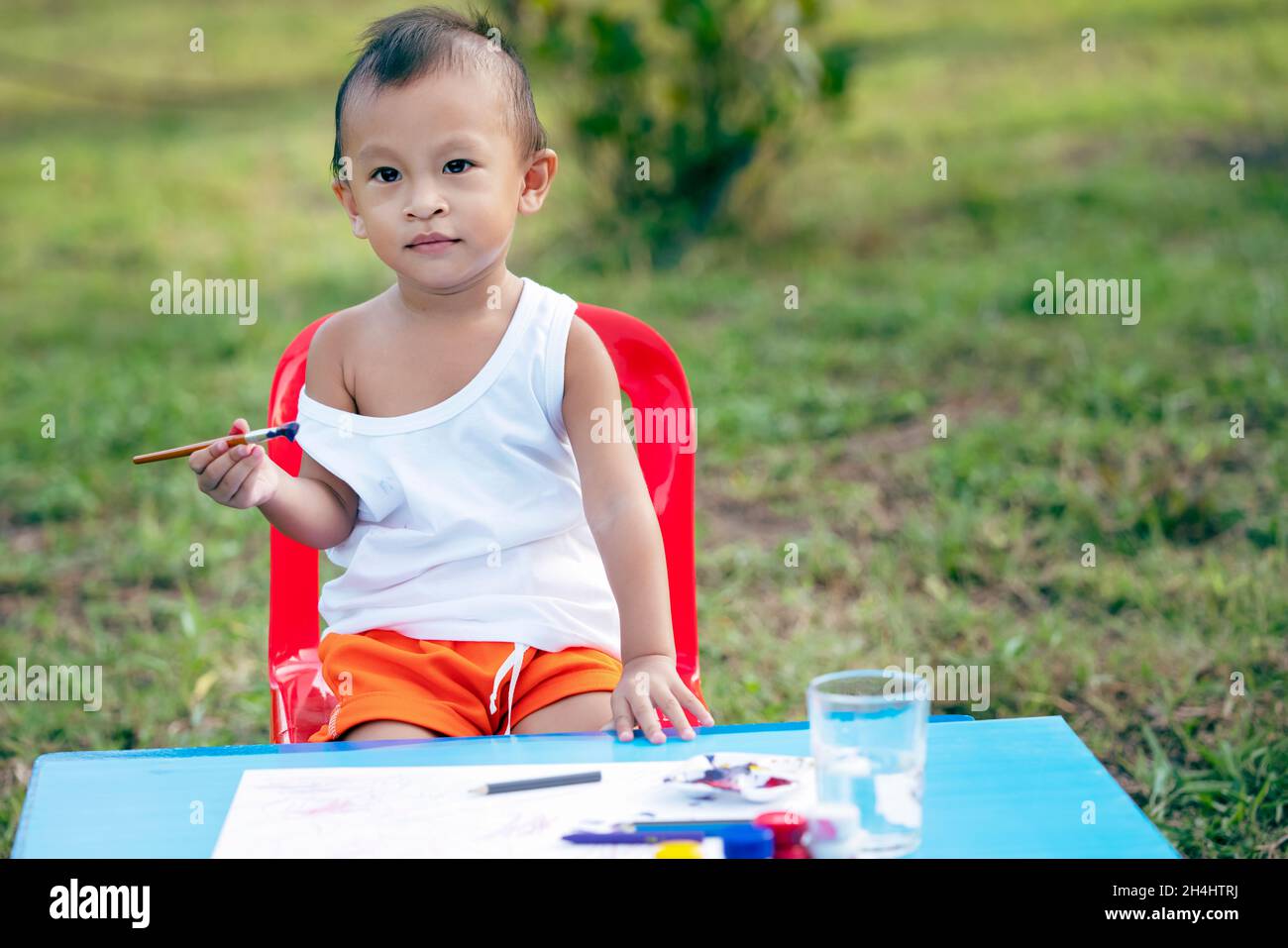 Kid Painting. Happy little cute child girl with dirty hands and fingers ...