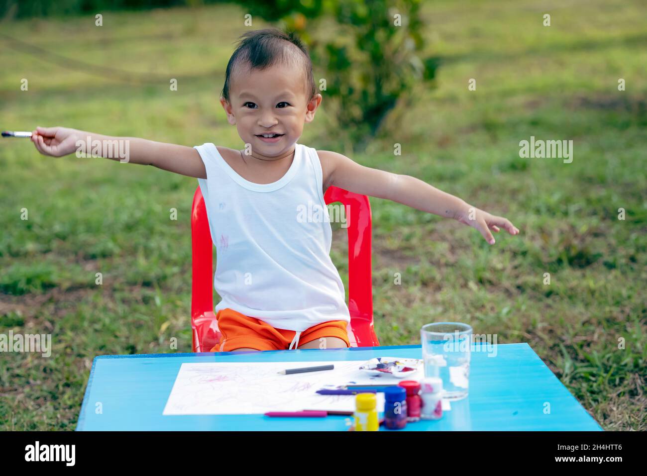 Kid Painting. Happy little cute child girl with dirty hands and fingers ...