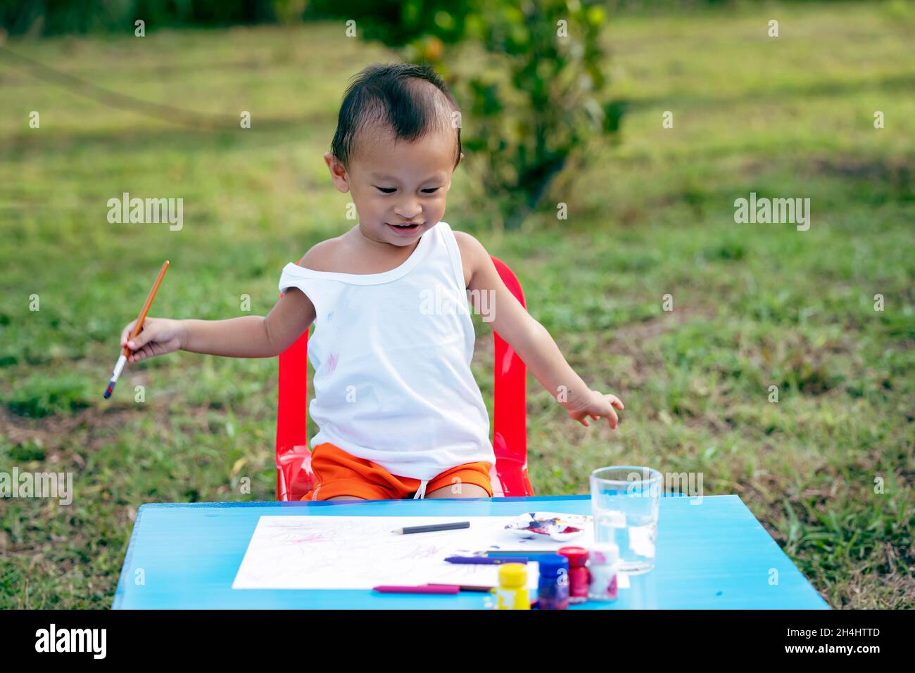Kid Painting. Happy little cute child girl with dirty hands and fingers ...