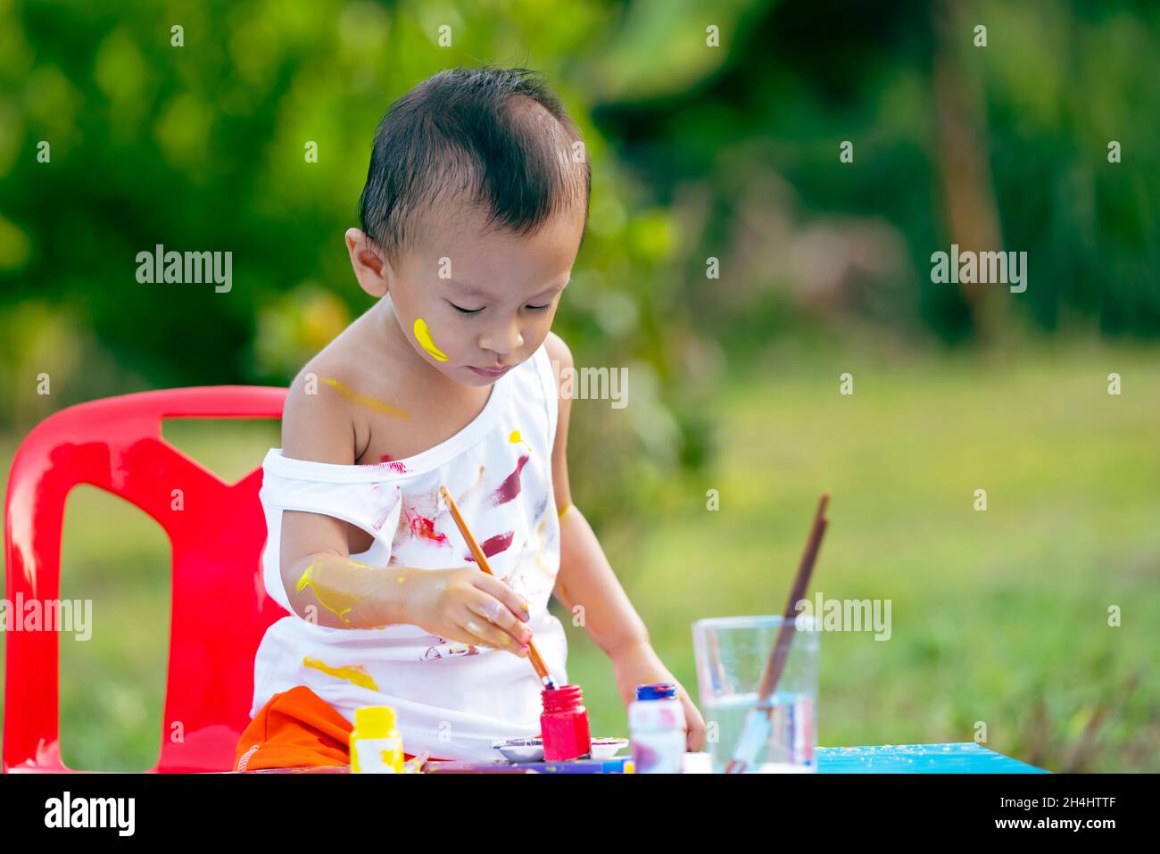 Kid Painting. Happy little cute child girl with dirty hands and fingers ...