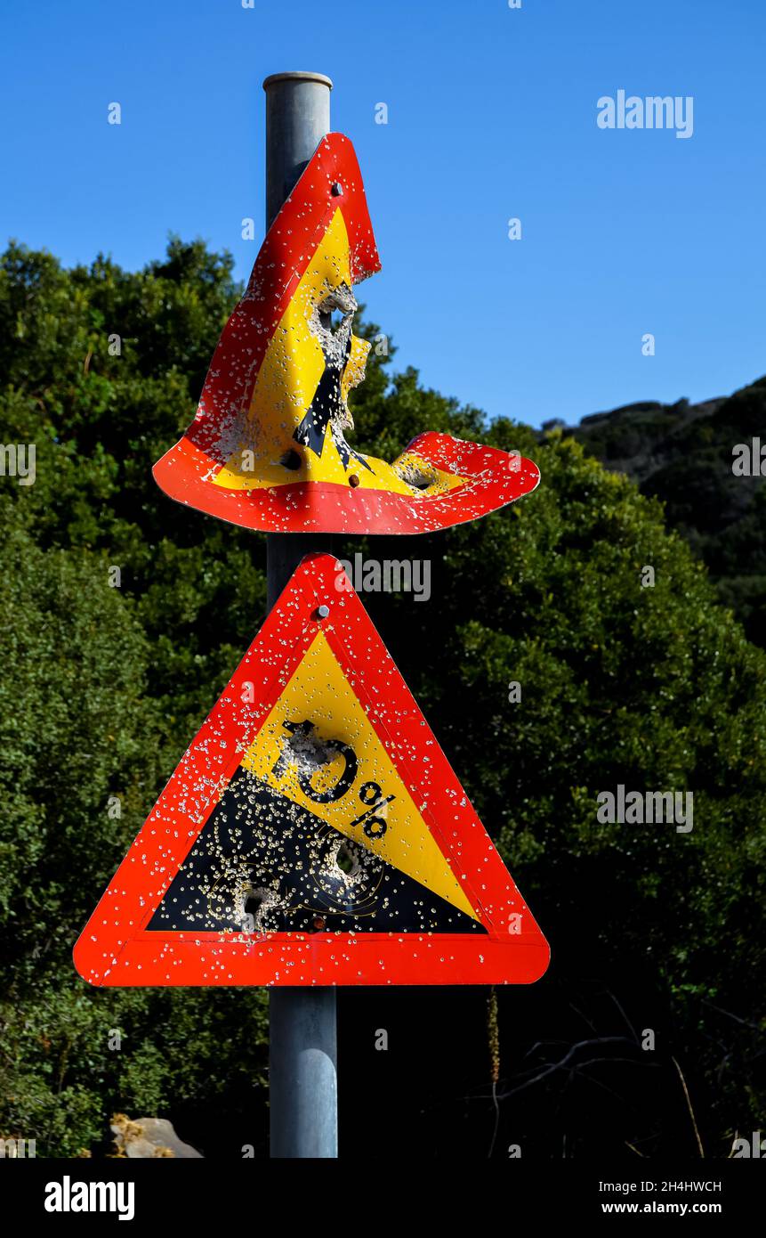 Vertical shot of damaged road signs near trees in Crete, Greece Stock ...