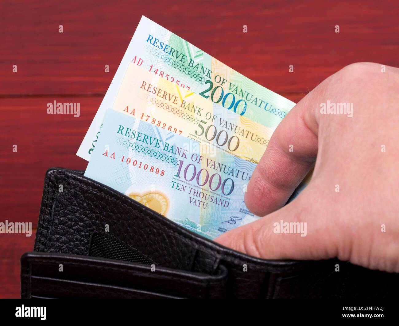 Vanuatu money - vatu in the black wallet Stock Photo - Alamy