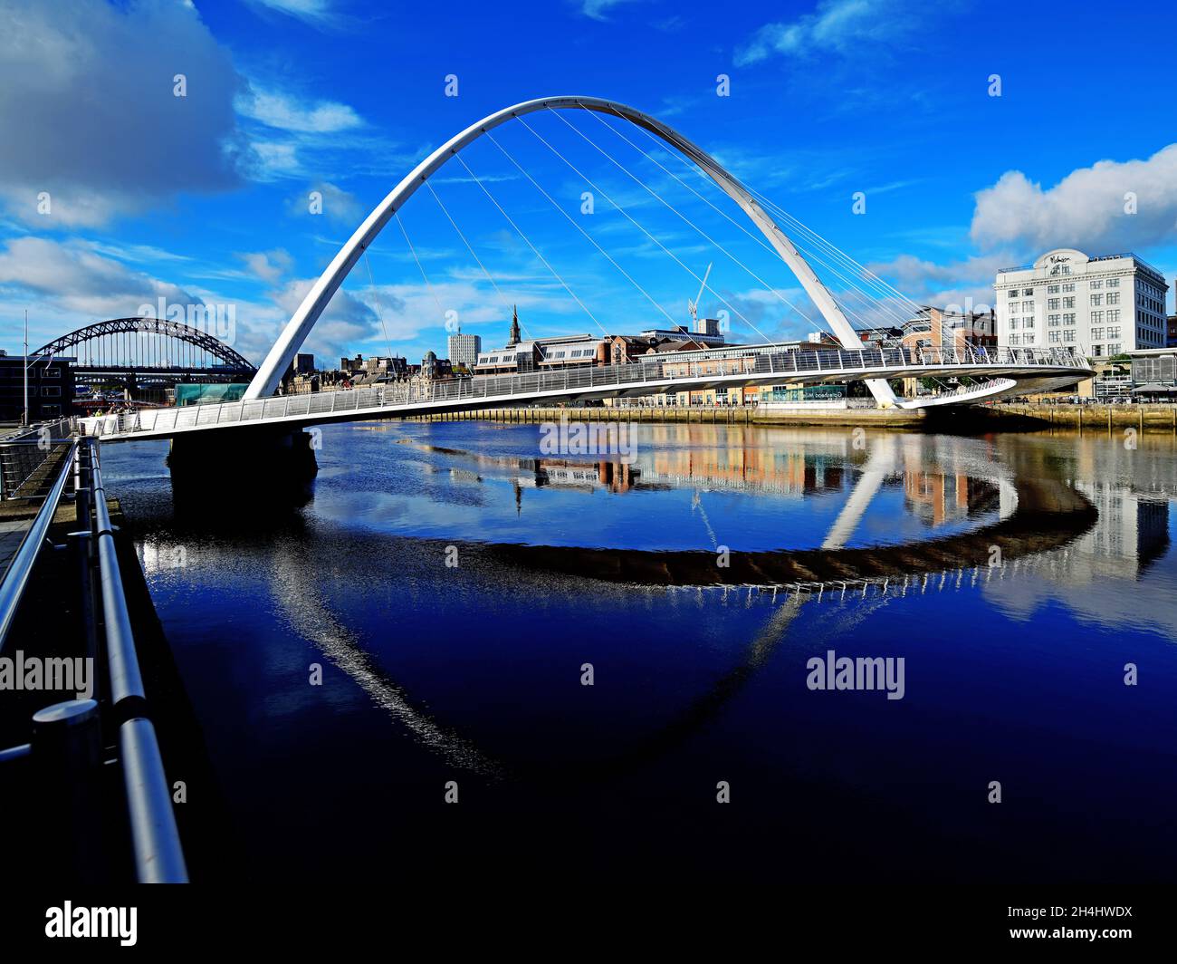 Gateshead Millenium Bridge with reflections overlooking the Newcastle ...