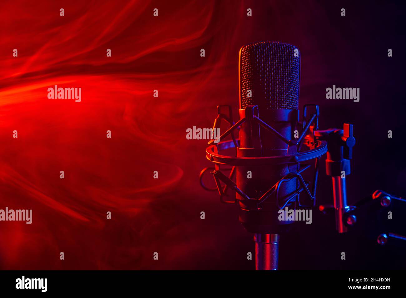Professional microphone in red smoke on a black background Stock Photo ...