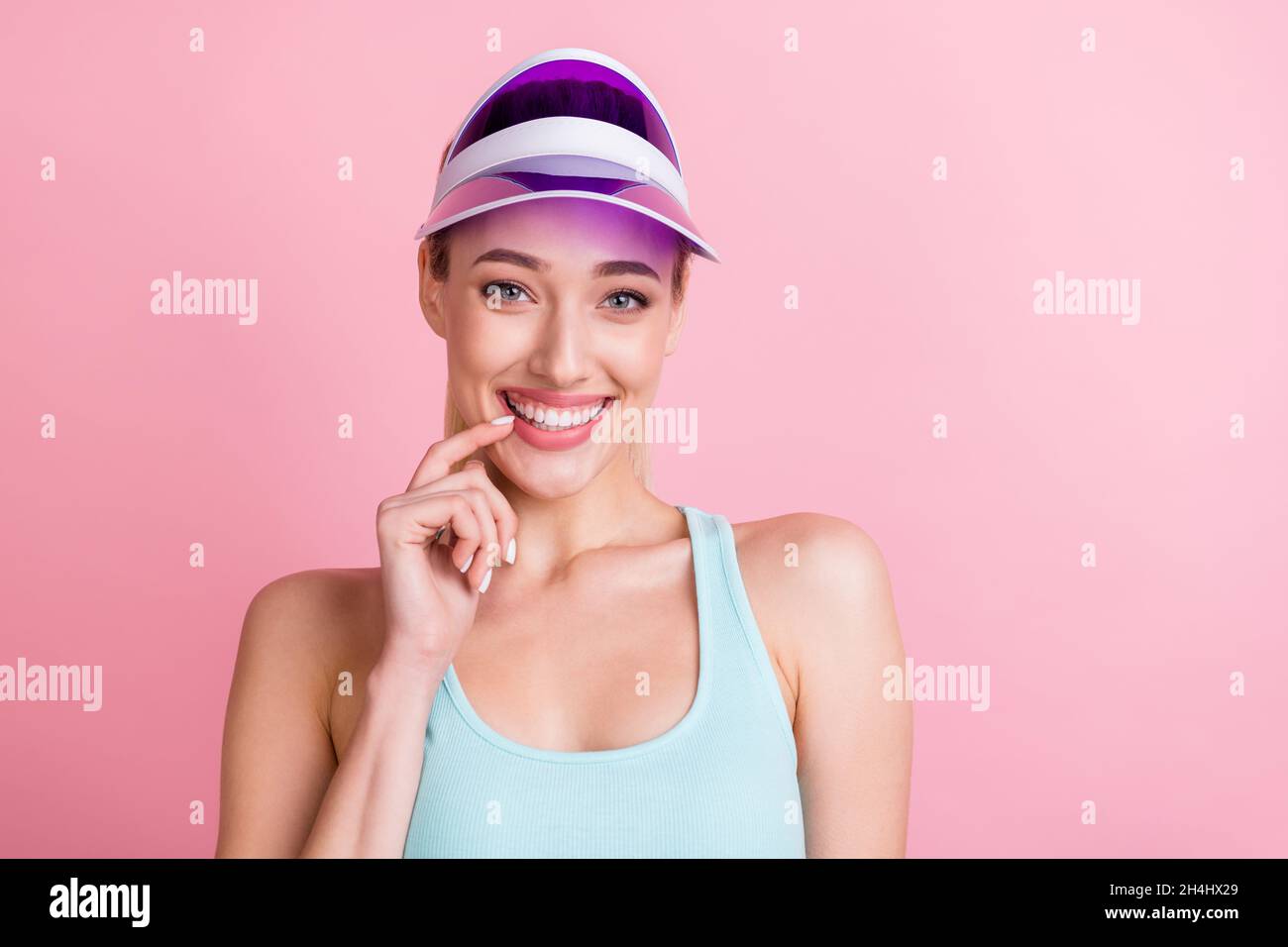 Portrait of attractive cheerful feminine girl posing biting nail good ...