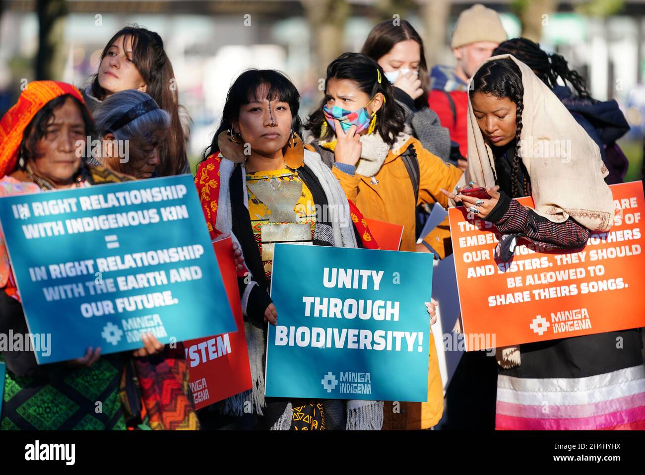 Indigenous people in ceremonial dress before marching from from the ...