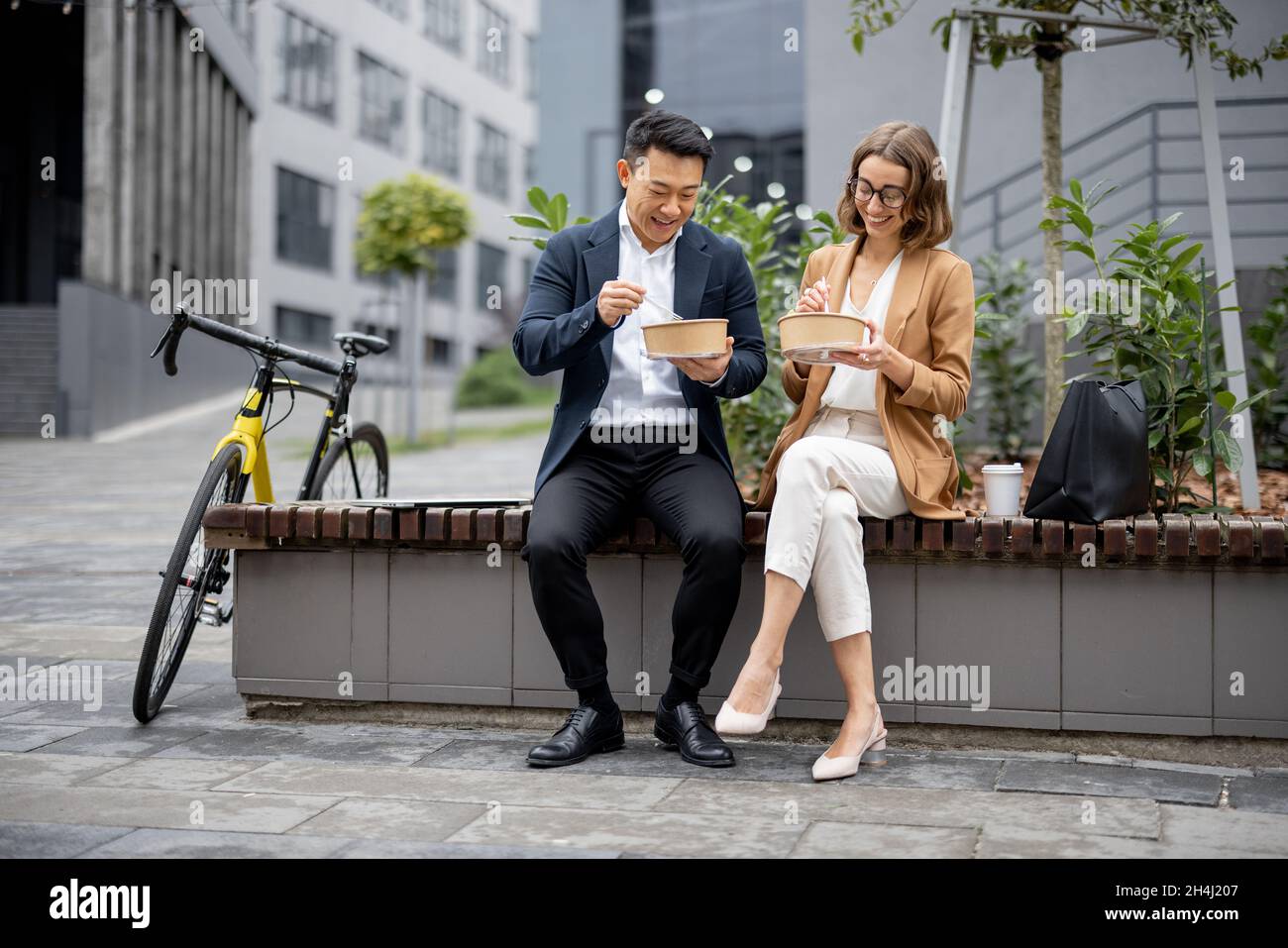 Business people having lunch at work in city Stock Photo - Alamy