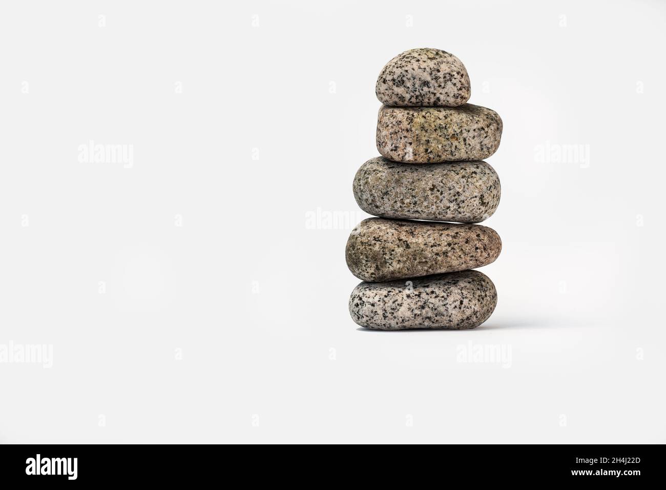 5 stones built as a pyramid isolated on white background Stock Photo ...