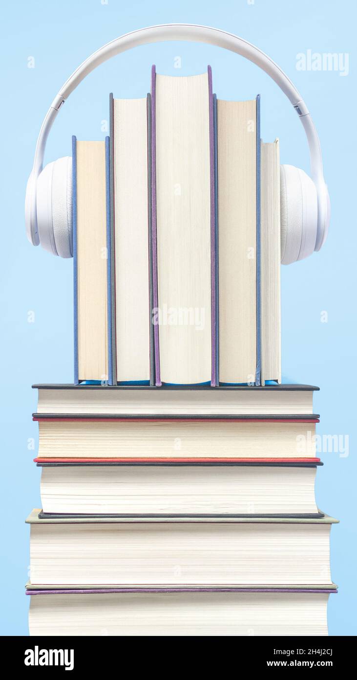 Closeup of a stack of books with headset- concept for audio book Stock ...