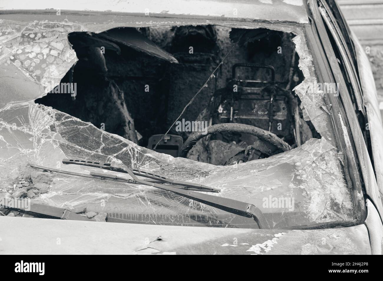 Broken and melted windshield of burnt out car after fire Stock Photo ...