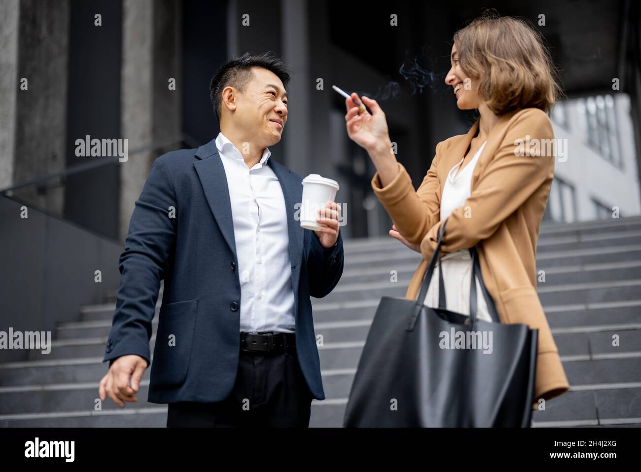 People smoking cigarettes during break at work Stock Photo - Alamy