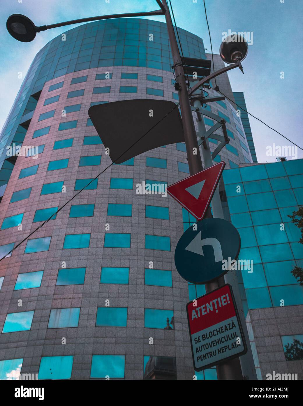 BUCHAREST, ROMANIA - Sep 01, 2021: A low-angle shot of traffic signs ...