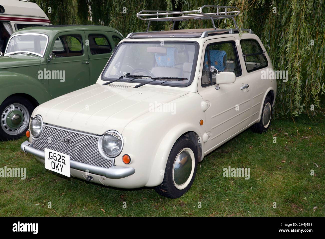 Three-quarters Front View of a Cream, 1989, Nissan Pao, on display at ...