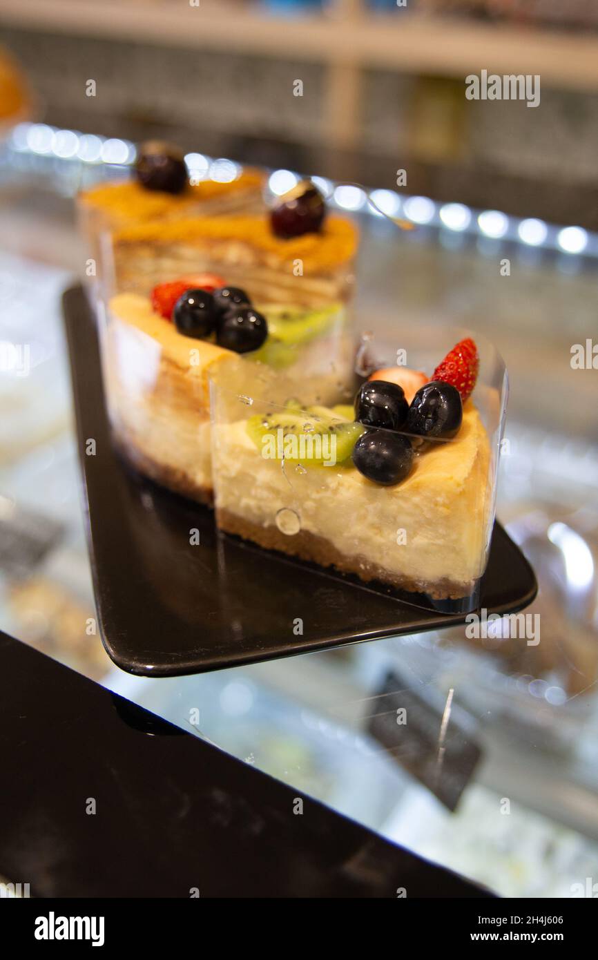 assorted cakes on a black plate in cooking Stock Photo - Alamy