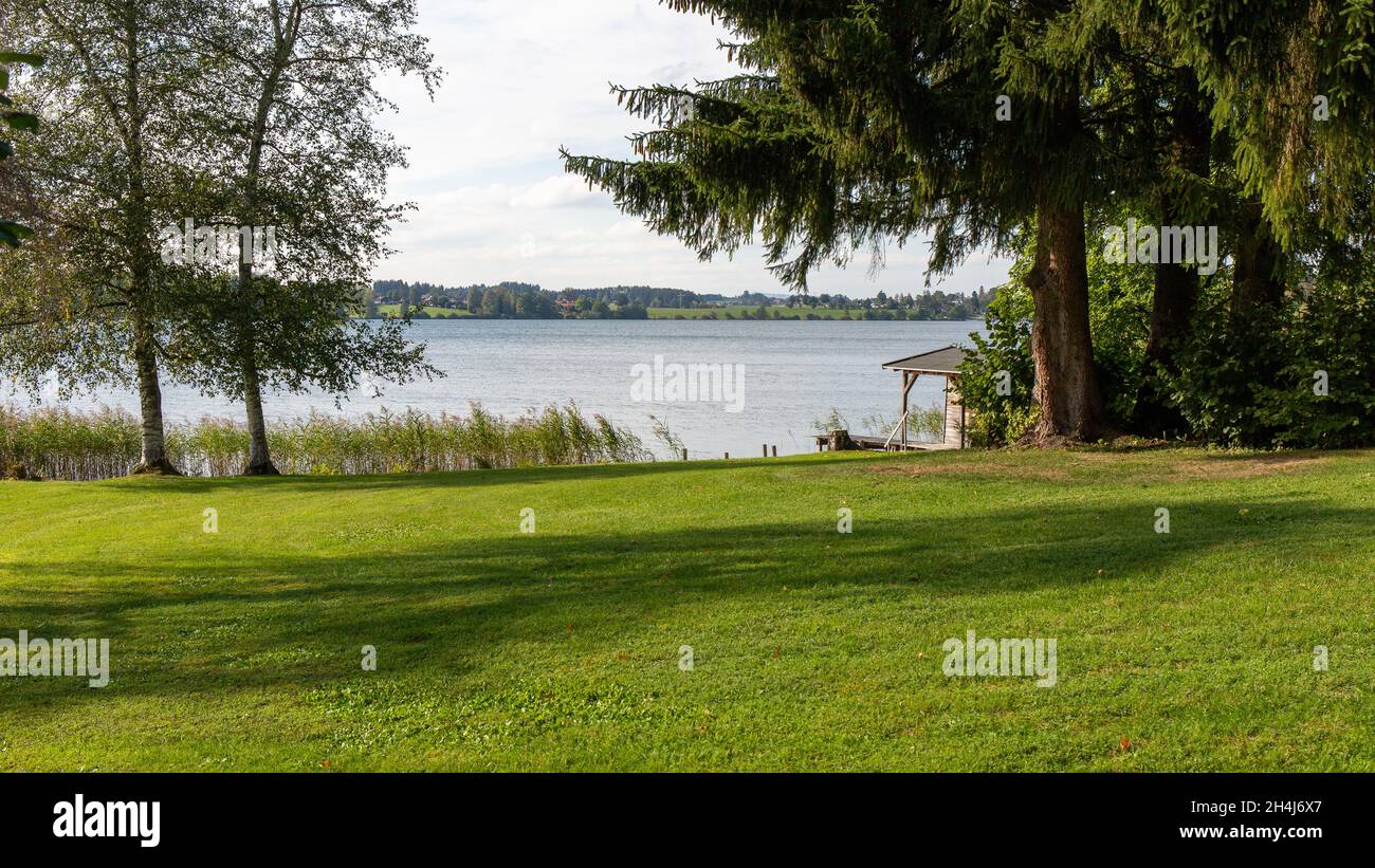 romantic bathing place on the lake with stairs into the water, bathing ...