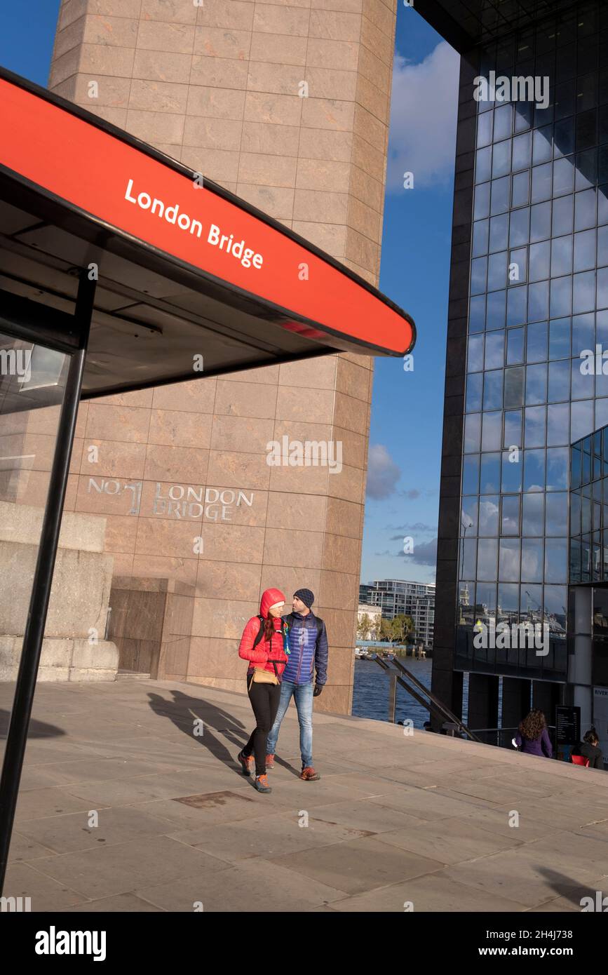 Members of the public walk beneath eighties architecture number 1 ...