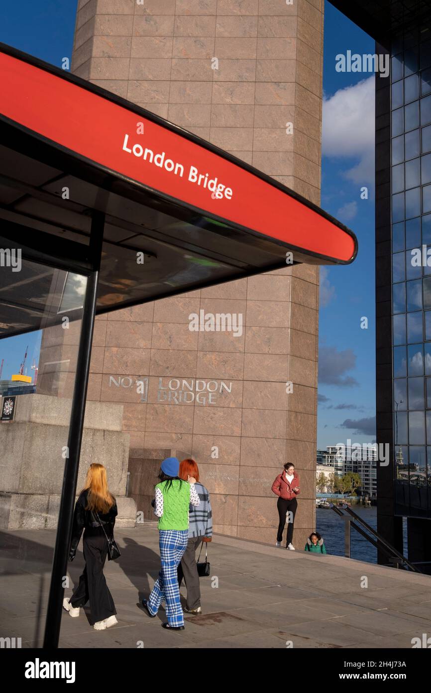 Members of the public walk beneath eighties architecture number 1 ...